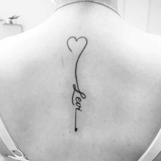 17 Cursive Spine Tattoo Ideas: Timeless Elegance and Grace