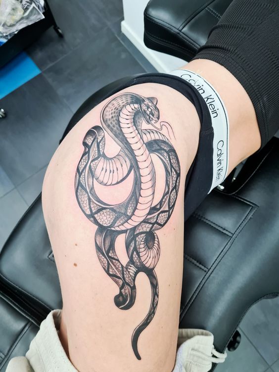 23 Snake Tattoos on Thigh: Alluring Art for Your Legs